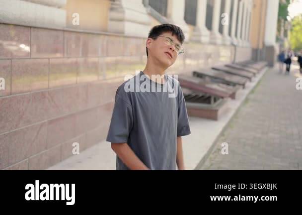 Expressive young person reacting emotionally to smartphone message with ...