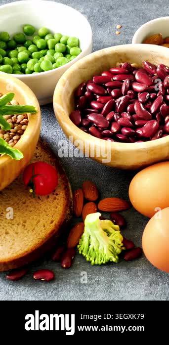 vertical top view of protein rich food sources with red beans, eggs ...