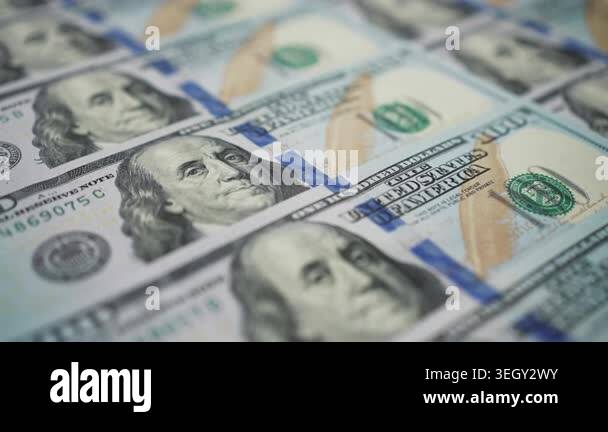 Close up of hundred dollar bills moving downwards. Concept of cash flow ...