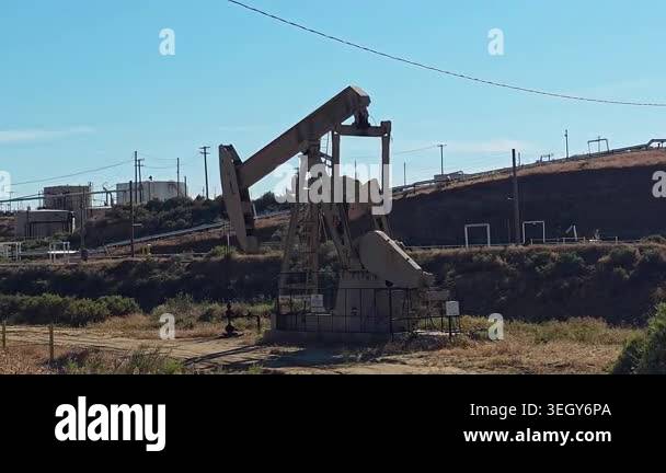 Oil Pump Jack Working In Dry Industrial Field, documentary energy video ...