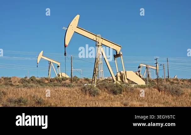 Oil Pump Jacks Working Across Dry California Field, documentary energy ...