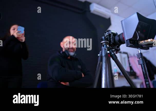 Professional camera setup with teleprompter and man in studio. Close up ...