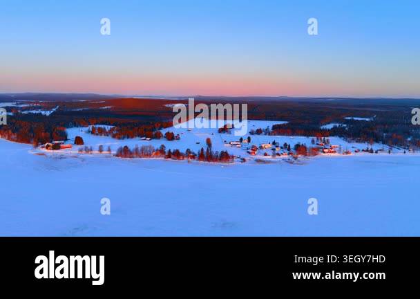 Huge fields covered with snow near the small village surrounded by ...