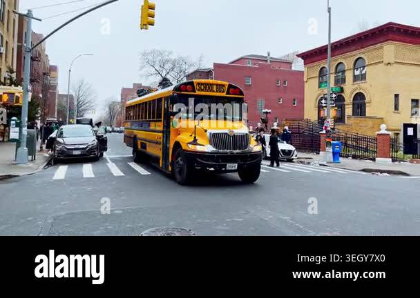 New York, USA, 9 March 2022: Yellow school bus side view on New York ...