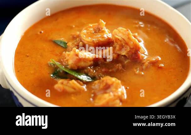 Indian prawn curry with coconut gravy and shrimp served hot in closeup ...