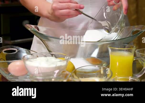 hands woman in white dress knead butter dough, adding sugar honey sour ...