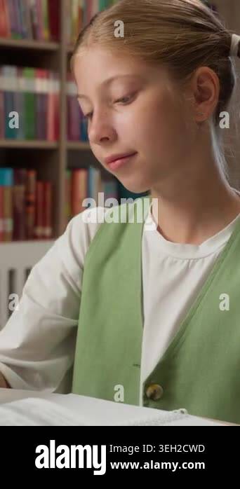 Happy wonder surprised Caucasian little girl child reading book ...