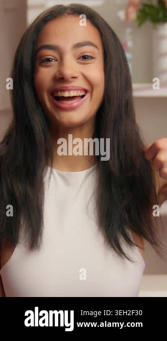 Smiling Hispanic Latina woman showing thumb up enjoy beauty daily ...