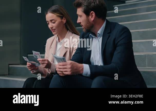 Caucasian colleagues business man woman count money salary financial ...