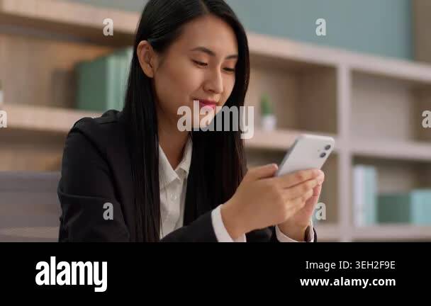 Smiling positive Asian Japanese girl office worker secretary business ...