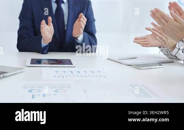 Professional colleagues clapping hands, celebrating successful ...