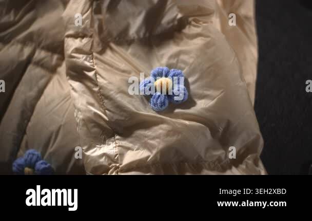 Closeup Beige Puffer Jacket Showing Crochet Flower, Soft Studio ...