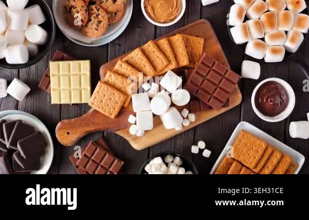 Smores buffet table scene. Slow rotating zoom motion. Roasted ...