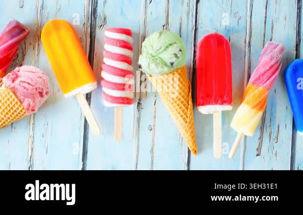 Selection of colorful summer popsicles and ice cream treats. Slow ...