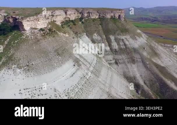 Drone view over eroded limestone mountains with white sandstone cliffs ...