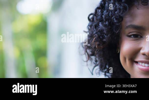 Camera pulling back as woman smiling, revealing dimples and earring by ...