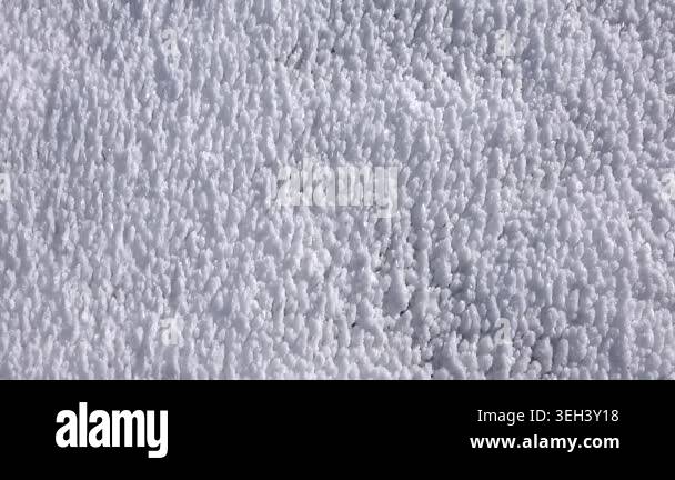 Crystal hoarfrost rime layer accumulated on a cold winter surface ...