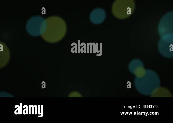 Glowing bokeh lights on black background Stock Video Footage - Alamy
