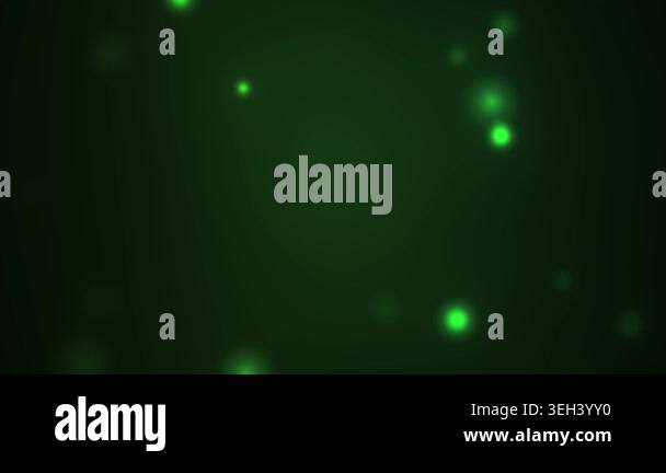 Glowing green particles float in dark Stock Video Footage - Alamy