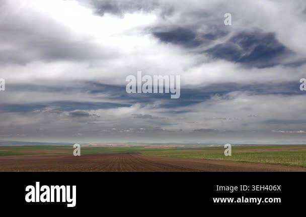 Timelapse australian farmland red soil furrows moving clouds cropland ...