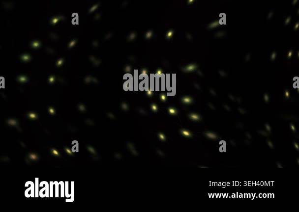 Glowing particles floating on black Stock Video Footage - Alamy
