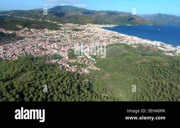 Marmaris bay curves beside forested hills, framing resort harbor ...