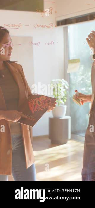 Vertical video: Diverse women handing cookbook, lead sharing ideas in ...