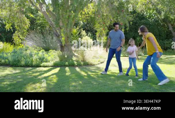 Family parents and child walking, adults gesturing then parents chasing ...