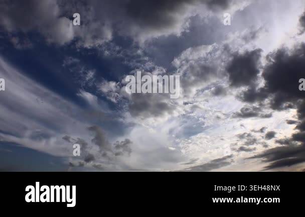 Dramatic storm clouds above countryside fields, mountain ridge ...