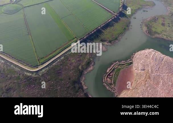 Aerial view of Amik Plain village beside wetland lake and river reeds ...