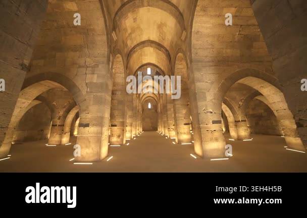 Stone arches and columns line Sultanhani Caravanserai interior in ...