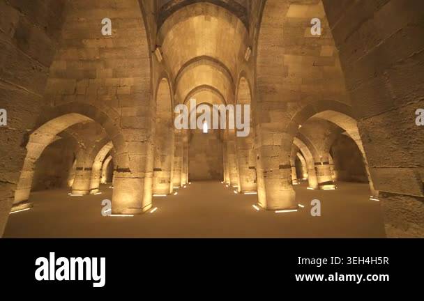 Stone arches and columns line Sultanhani Caravanserai interior in ...