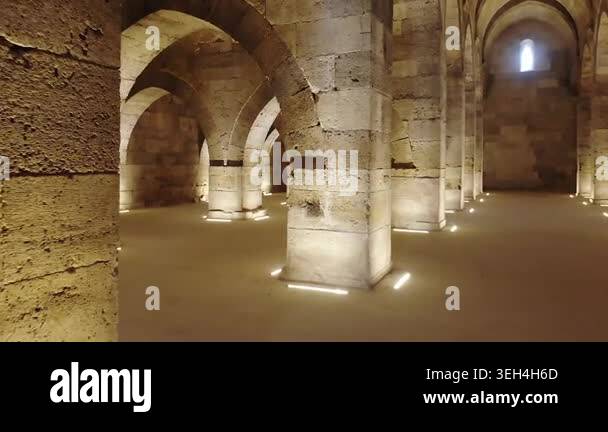 Stone arches and columns line Sultanhani Caravanserai interior in ...
