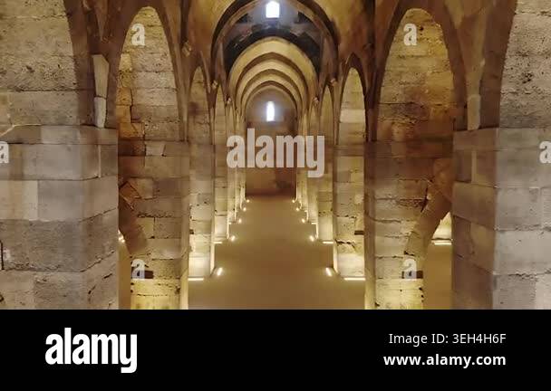 Stone arches and columns line Sultanhani Caravanserai interior in ...