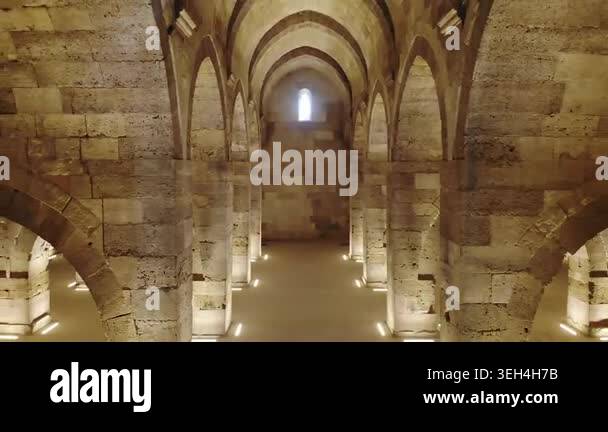 Stone arches and columns line Sultanhani Caravanserai interior in ...