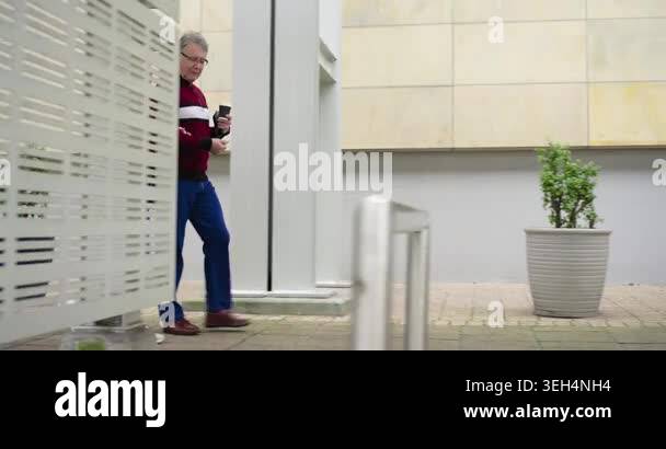 Conversing, woman gesturing to partner, senior couple walking beside ...