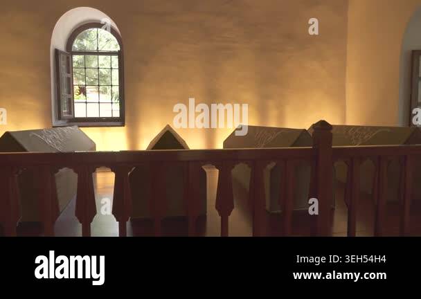 Cloth covered caskets rest inside Islamic tomb, sacred interior ...