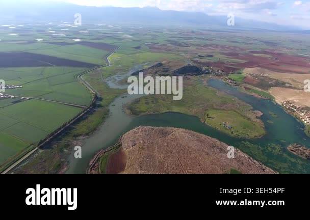 Aerial view of Amik Plain village beside wetland lake and river reeds ...