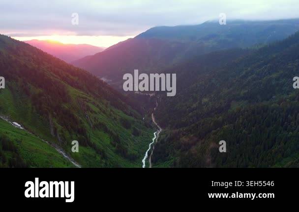 Aerial drone view of New Zealand forest mountains, river valley ...