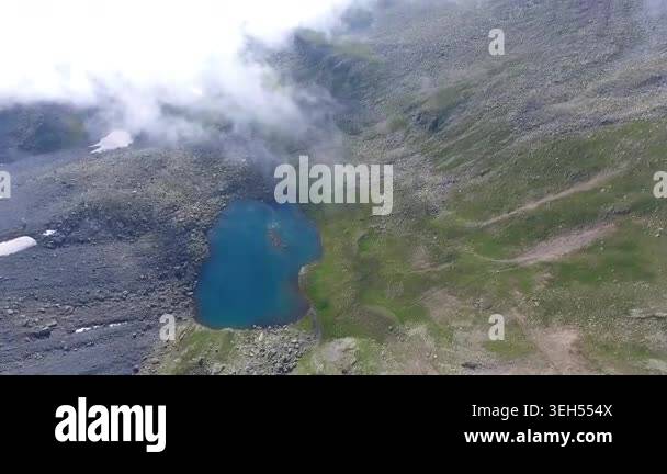 Rocky Mountains USA alpine lake beneath rugged peaks reveals calm ...