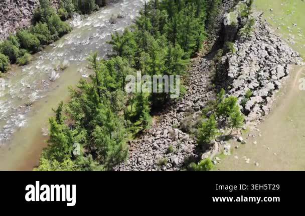 Aerial view of rocky river canyon in Mongolian depression valley, fast ...