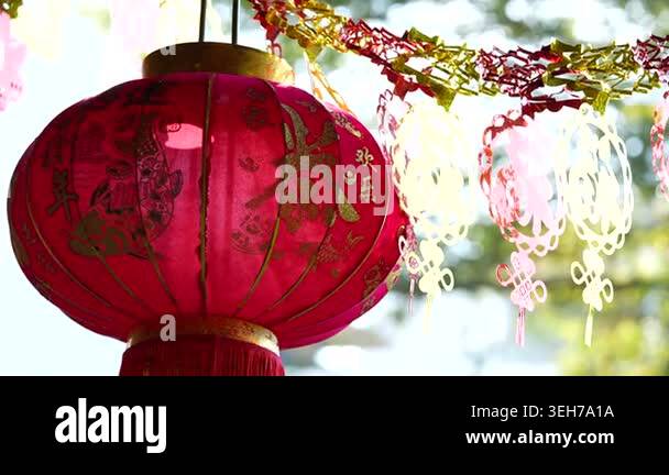 Traditional red Chinese lantern with golden decorative characters ...