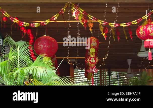 Traditional red Chinese lantern with golden decorative characters ...