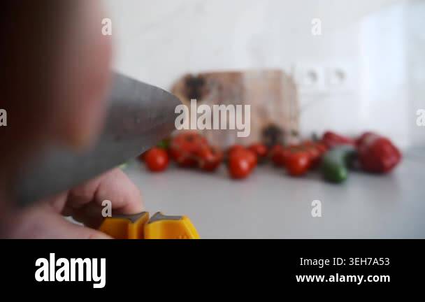 Hands Hone Large Kitchen Knife With Sharpener In Kitchen, Object POV ...