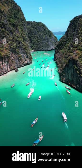 Aerial drone pullback over Pi Leh Bay lagoon, Phi Phi Lee Island ...