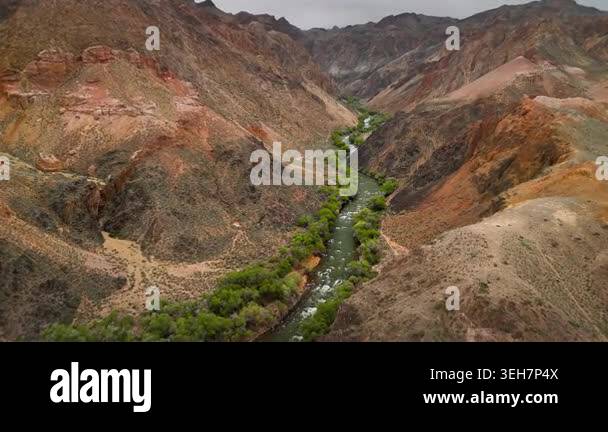 Aerial Drone View of river and red rocks in Valley of Castles at Charyn ...