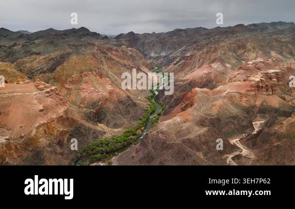 Aerial Drone View of river and red rocks in Valley of Castles at Charyn ...