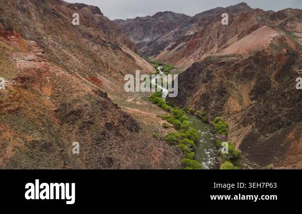 Aerial Drone View of river and red rocks in Valley of Castles at Charyn ...