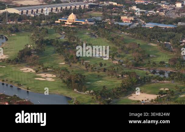 High aerial perspective capturing a beautiful golf course featuring ...