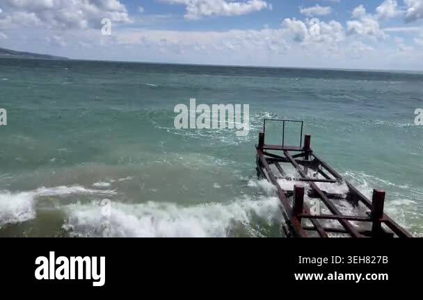 Huge Waves Crashing Against Old Rusty Pier, Industrial Coastal Scene ...